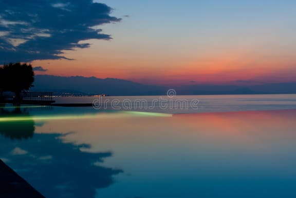 Infinity Pool on the Beach at Sunset Stock Image - Image of coast ...