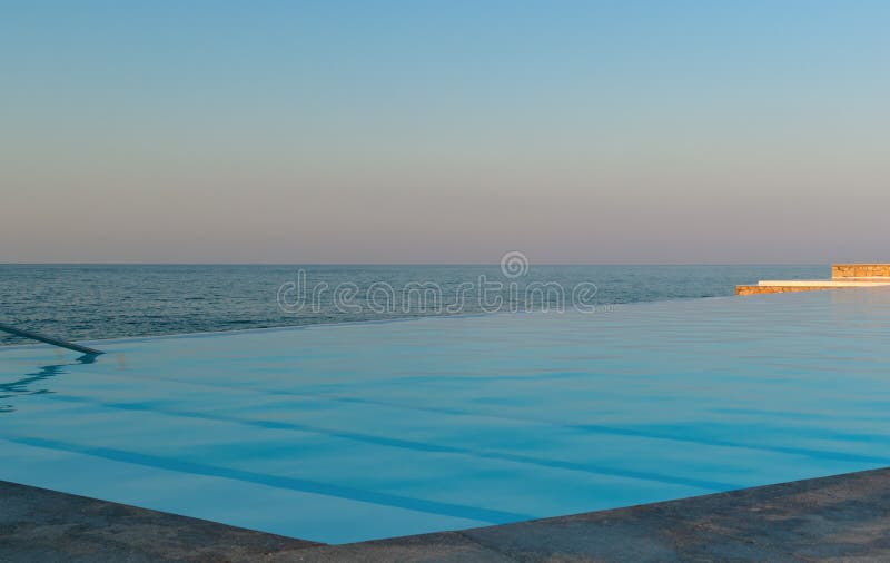 Infinity Pool on the Beach at Sunset Stock Photo - Image of design ...