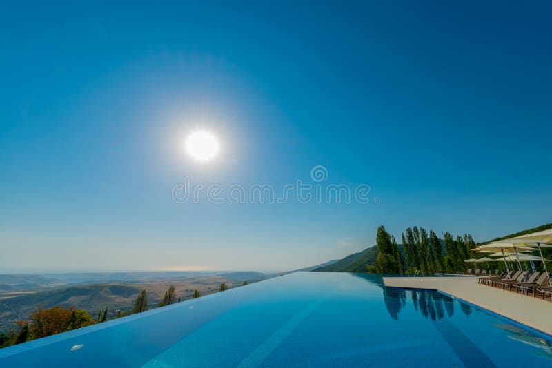 Infinity Pool on the Bright Summer Day Stock Photo - Image of chair ...