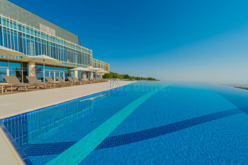 Infinity Pool on the Bright Summer Day Stock Image - Image of modern ...
