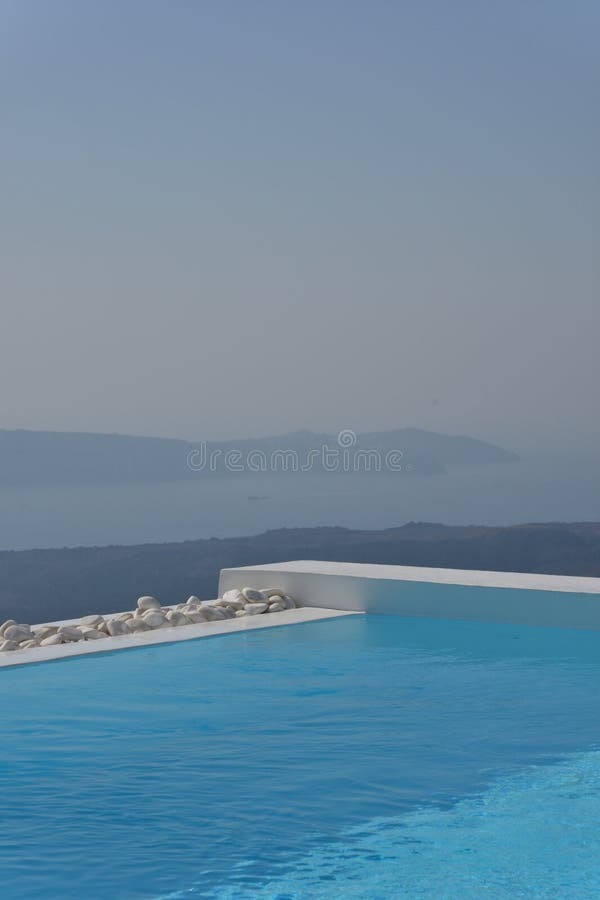 Infinity Pool with Sea and Mountain View in Santorini Stock Photo ...