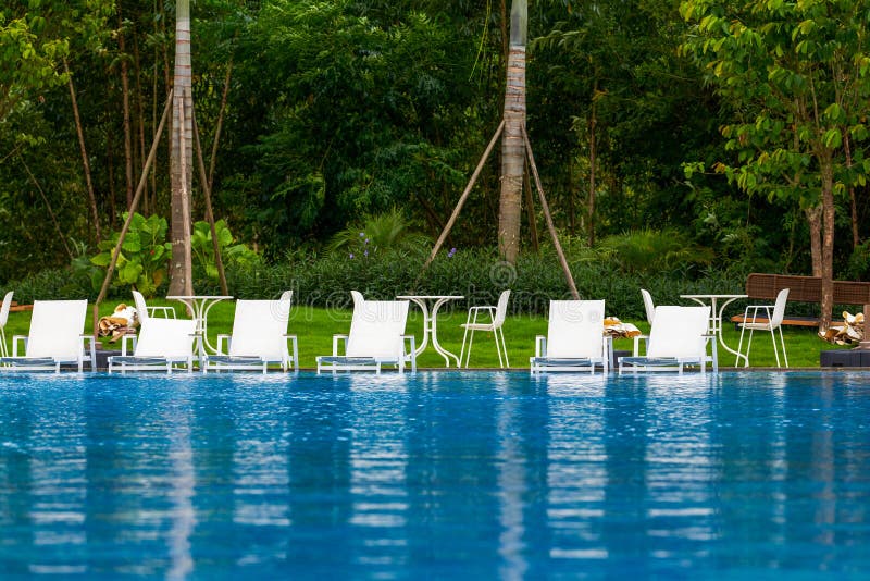 Infinity Pool and Lounge Chairs in a Luxury Hotel Stock Image - Image ...