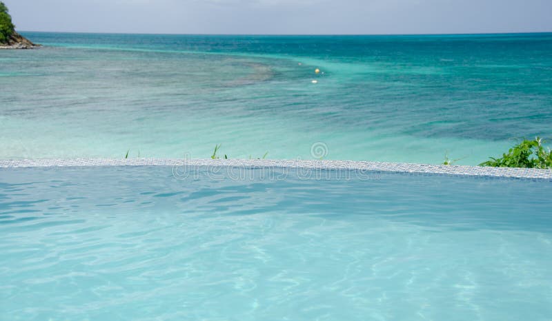 Infinity Pool Over Caribbean Beach Stock Photo - Image of harbor ...
