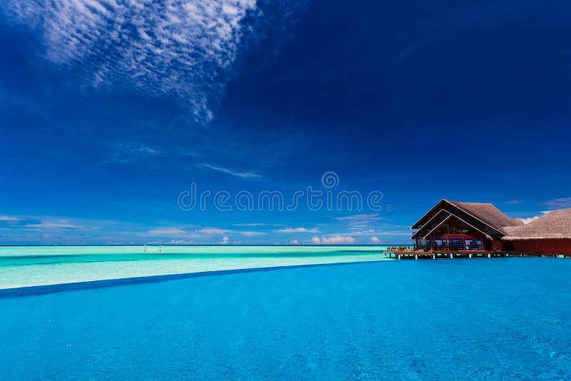 Infinity Pool Over Tropical Lagoon with Blue Sky Stock Image - Image of ...