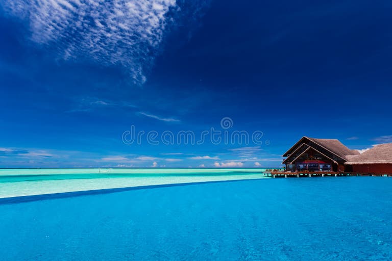 Infinity Pool Over Tropical Lagoon with Blue Sky Stock Image - Image of ...