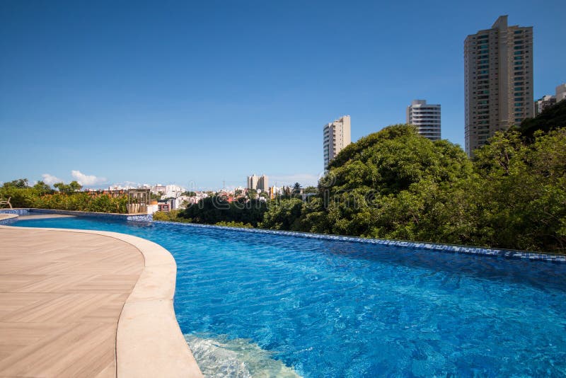 Infinity Pool with Trees and Buildings in the Background Editorial ...