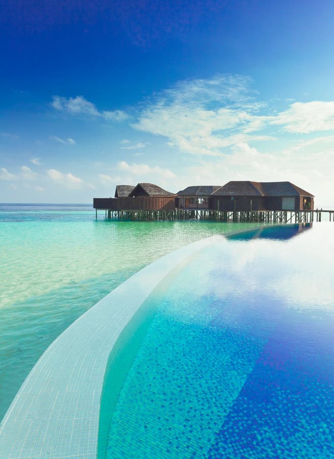 Infinity Pool and Water Villas Stock Image - Image of reflection ...