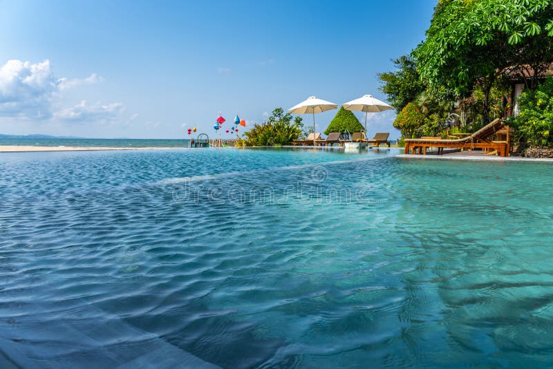 Infinity Swimming Pool at the Beautiful Beach Stock Image - Image of ...