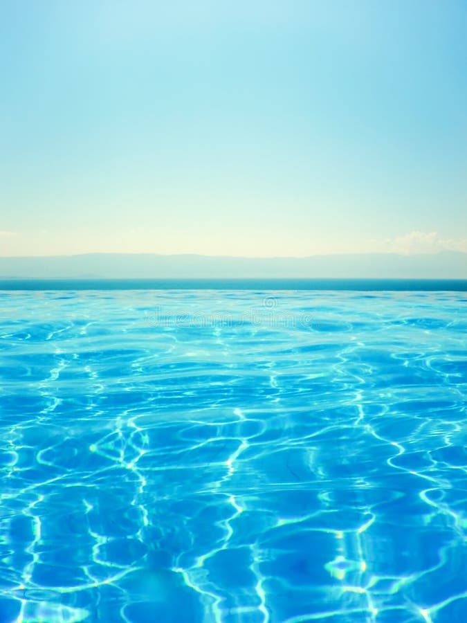 Infinity Swimming Pool with Sea and Mountain Stock Photo - Image of ...