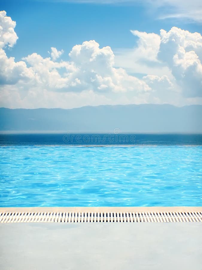 Infinity Swimming Pool with Sea and Mountain Stock Photo - Image of ...