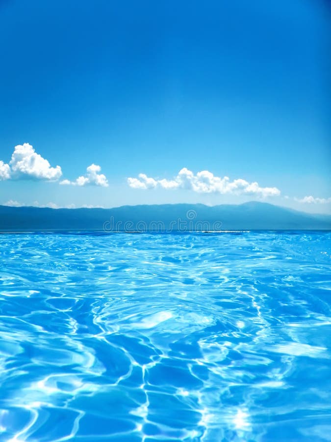 Infinity Swimming Pool with Sea and Mountain Stock Image - Image of ...