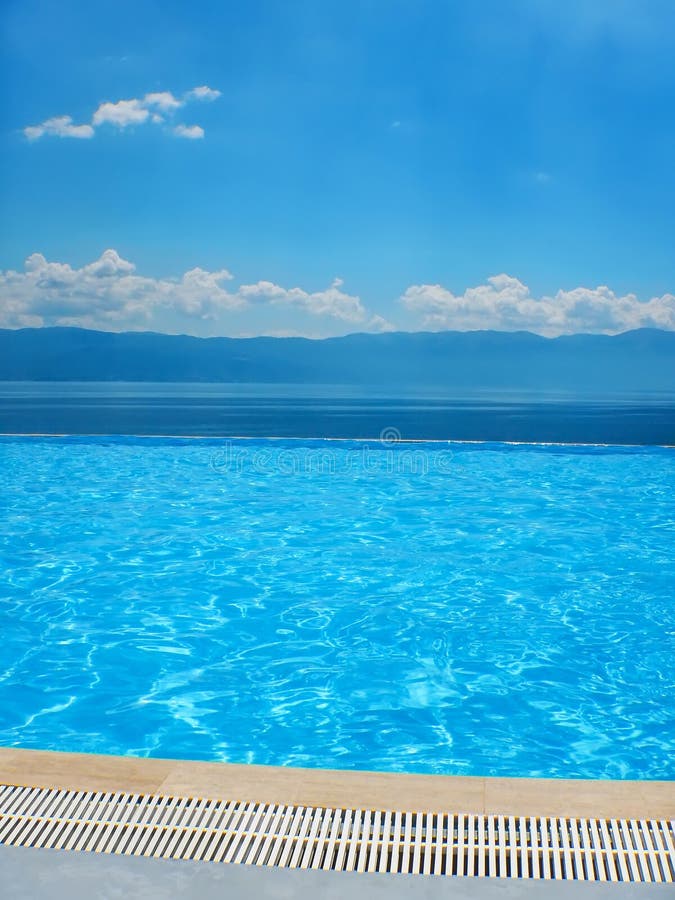 Infinity Swimming Pool with Sea and Mountain Stock Image - Image of ...