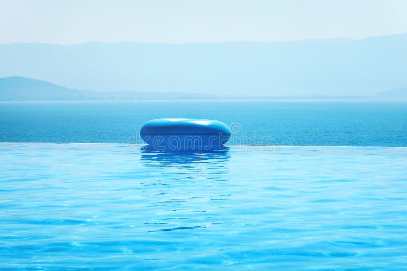 Infinity Swimming Pool with Sea and Mountain View Stock Image - Image ...