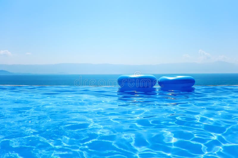 Infinity Swimming Pool with Sea and Mountain View Stock Image - Image ...