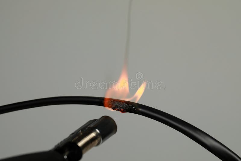 Inflamed Red Wire on Grey Background, Closeup. Electrical Short Circuit ...