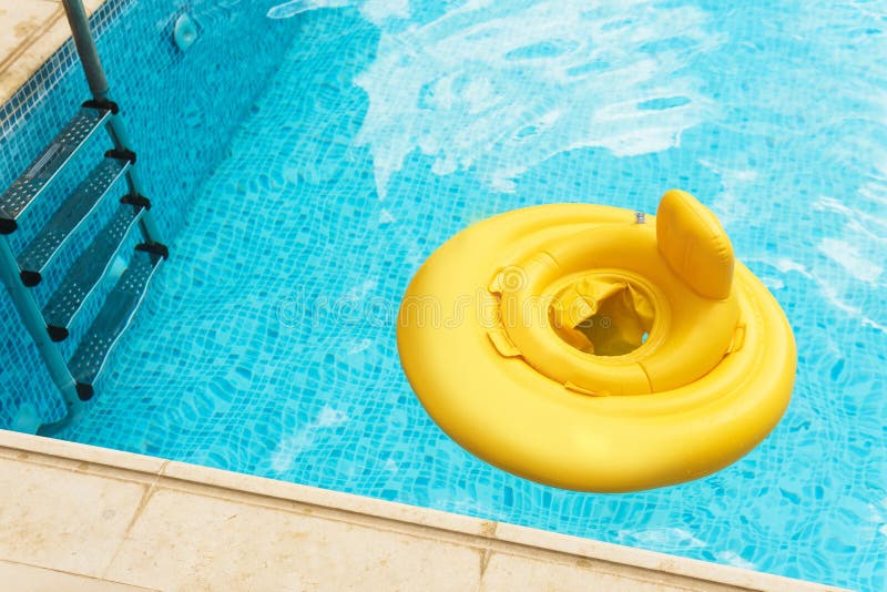 Inflatable Baby Float Ring in Open-air Swimming Pool Stock Photo ...