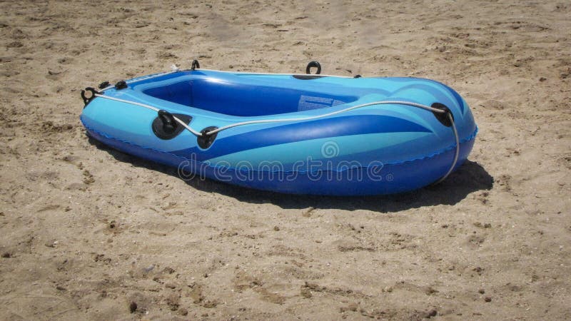 An Inflatable Boat on the Beach Stock Photo - Image of outdoors ...