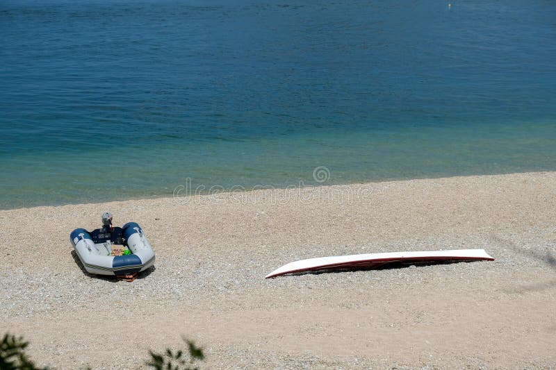 Inflatable Boat and Kayak on Empty Beach Stock Image - Image of outdoor ...