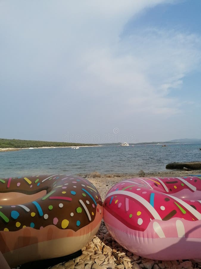 Inflatable Donut on the Beach Stock Photo - Image of beach, donut ...