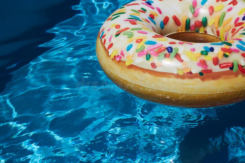 Inflatable Donut Ring in Blue Swimming Pool Stock Photo - Image of ...