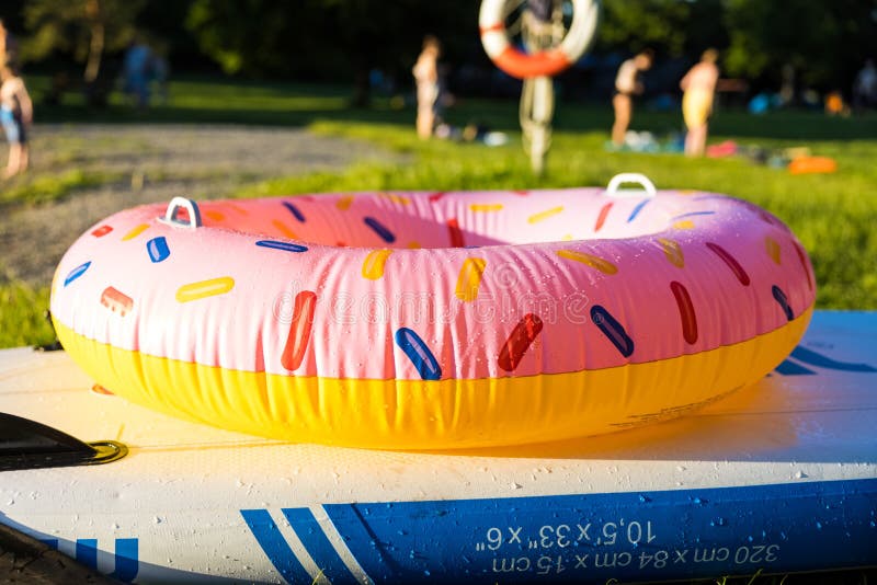 Inflatable Donut Swimming Ring on the House Lawn Stock Photo - Image of ...