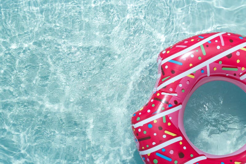 Inflatable Float Rubber Ring in the Form of a Pink Donut in the Blue ...