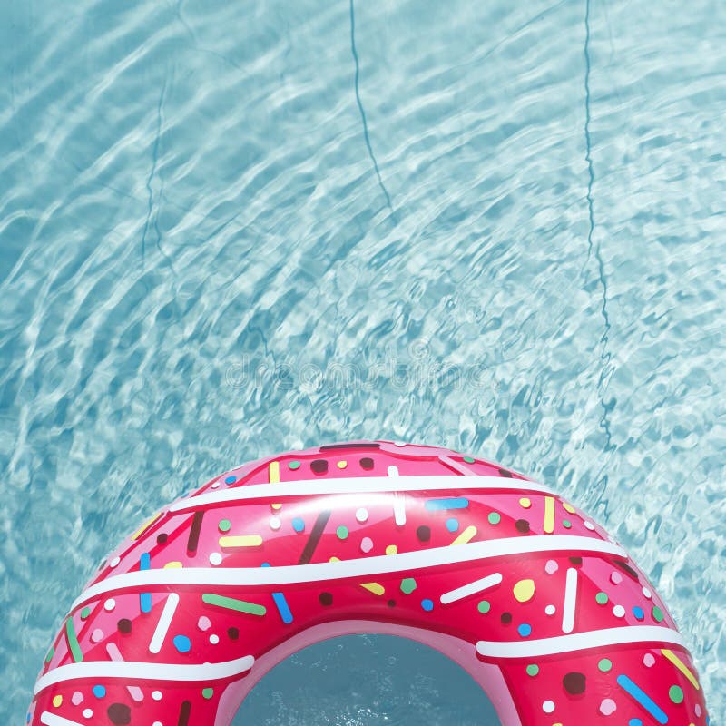 Inflatable Float Rubber Ring in the Form of a Pink Donut in the Blue ...