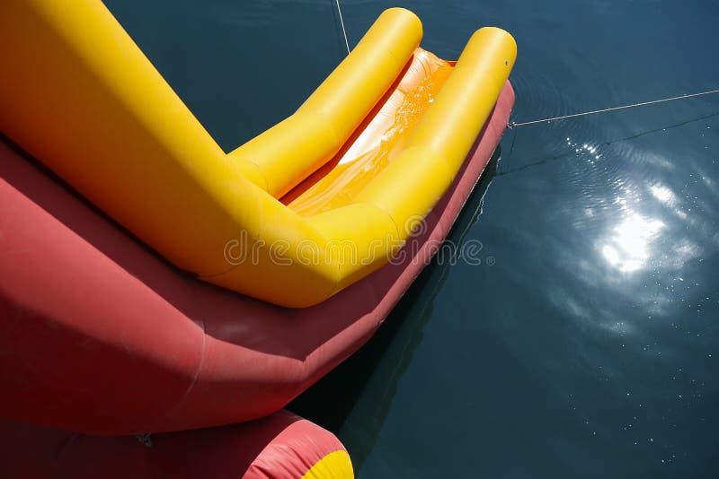 An Inflatable Hill for Sliding in Water Stock Image - Image of ...