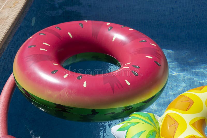 Inflatable Melon Ring Floating in Swimming Pool Stock Photo - Image of ...