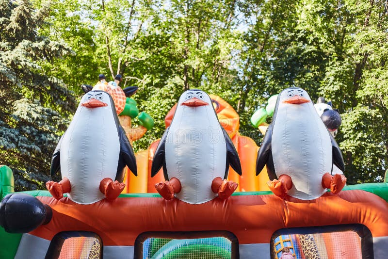 Inflatable Penguins from a Cartoon on a Children`s Attraction Stock ...