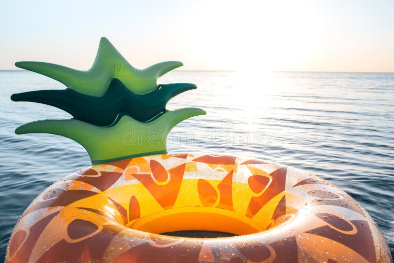 Inflatable Pineapple Floating in Sea. Close Up Shot of Rubber Ring with ...