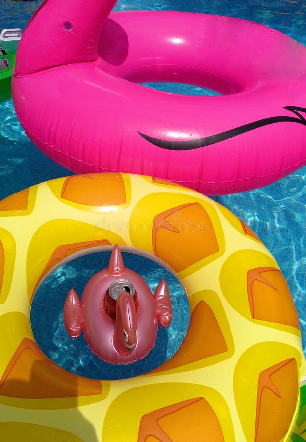 Inflatable Pineapple Ring Floating in Swimming Pool Stock Photo - Image ...
