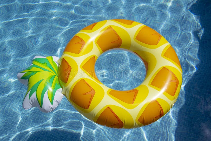 Inflatable Pineapple Ring Floating in Swimming Pool Stock Photo - Image ...