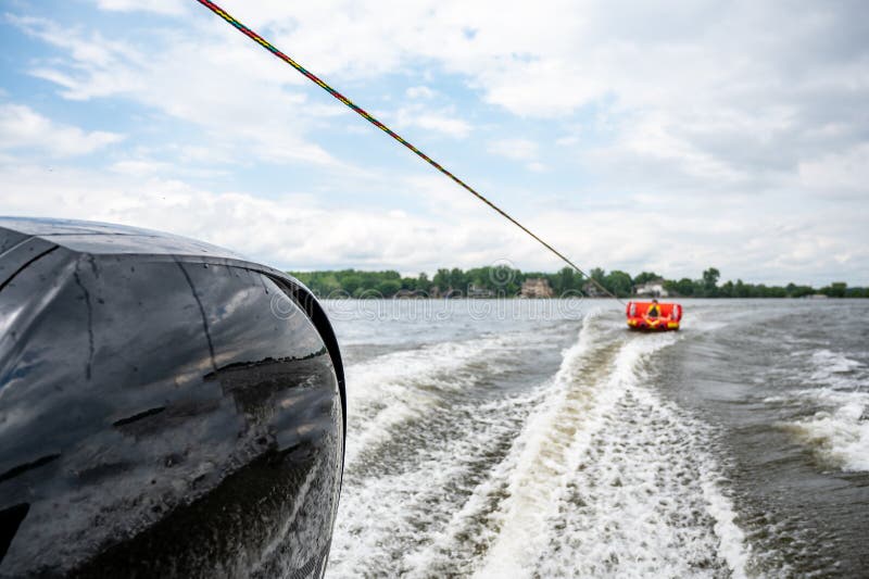 Inflatable Raft Being Pulled at a High Speed by a Boat in a ...