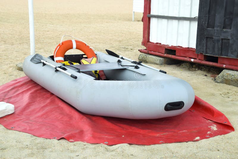 Inflatable Rescue Boat. Gray Inflatable Boat on the Beach in the Stock ...