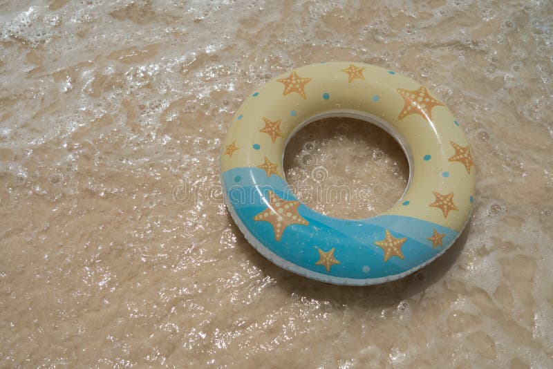 Inflatable Circle on the Beach Stock Image - Image of swimming, wave ...