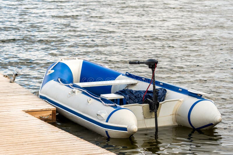 Inflatable Rubber Motor Boat at the Pier Stock Image - Image of liquid ...