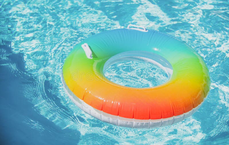 Inflatable Rubber Ring Floating in a Blue Water in Pool. Stock Image ...