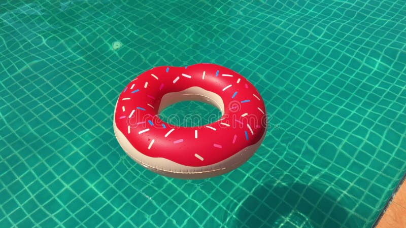 Inflatable Swim Doughnut in the Swimming Pool. Vacations Concepts Stock ...