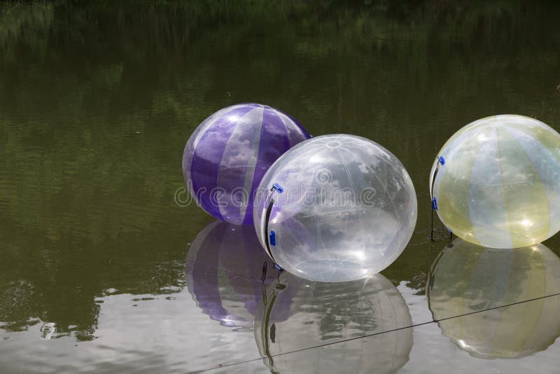 Inflatable Transparent Ball in Pond Stock Image - Image of ball, roll ...