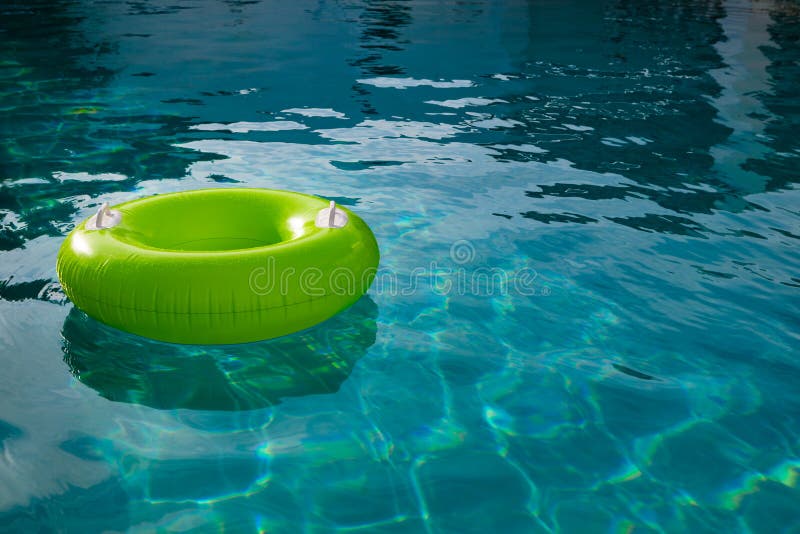 Inflatable Tube Floating in a Swimming Pool in Backyard Stock Image ...