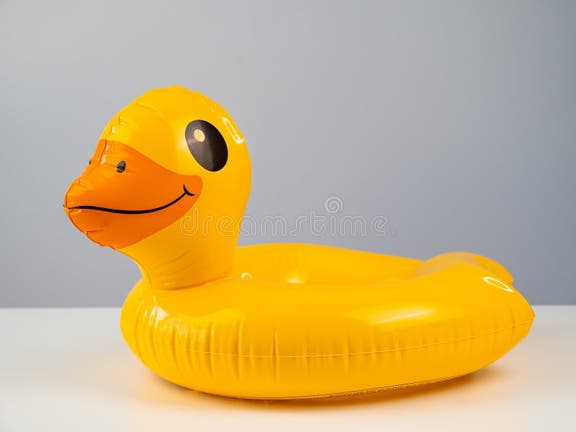 Inflatable Yellow Duck on a White Table. Stock Image - Image of ...