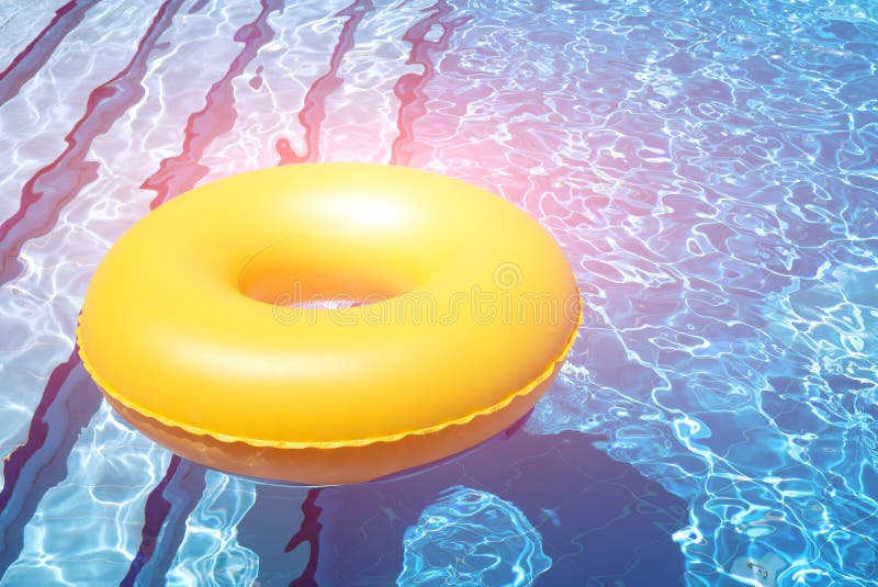 Inflatable Yellow Inner Tube Floating in Clear Blue Waters in Pool with ...