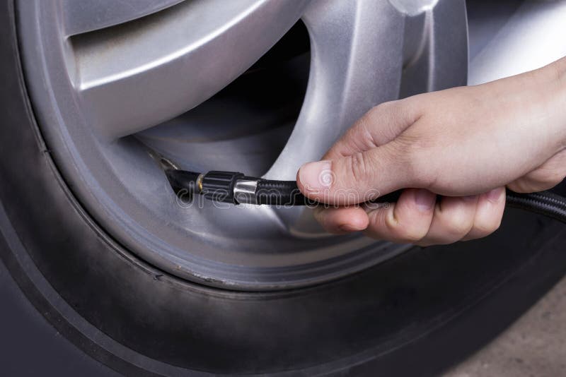 Inflating the wheels stock image. Image of pump, instrument - 75034181