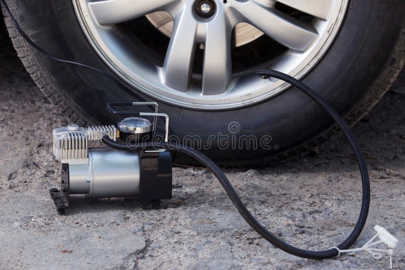 Inflating the wheels stock image. Image of males, compressor - 82492293