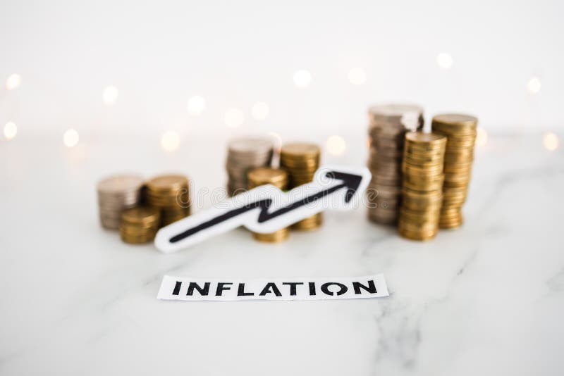 Inflation with Arrow Going Up in Front of Growing Stacks of Coins ...