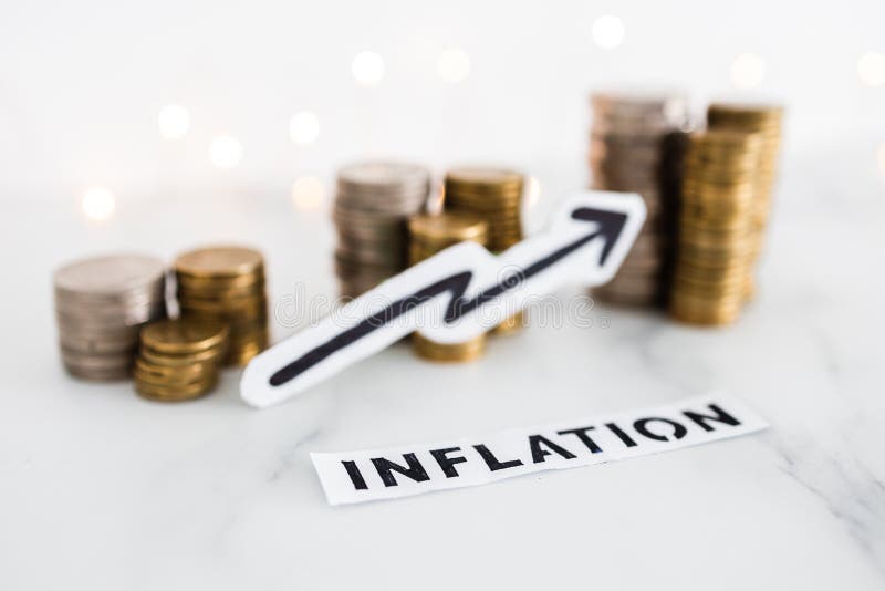 Inflation with Arrow Going Up in Front of Growing Stacks of Coins ...