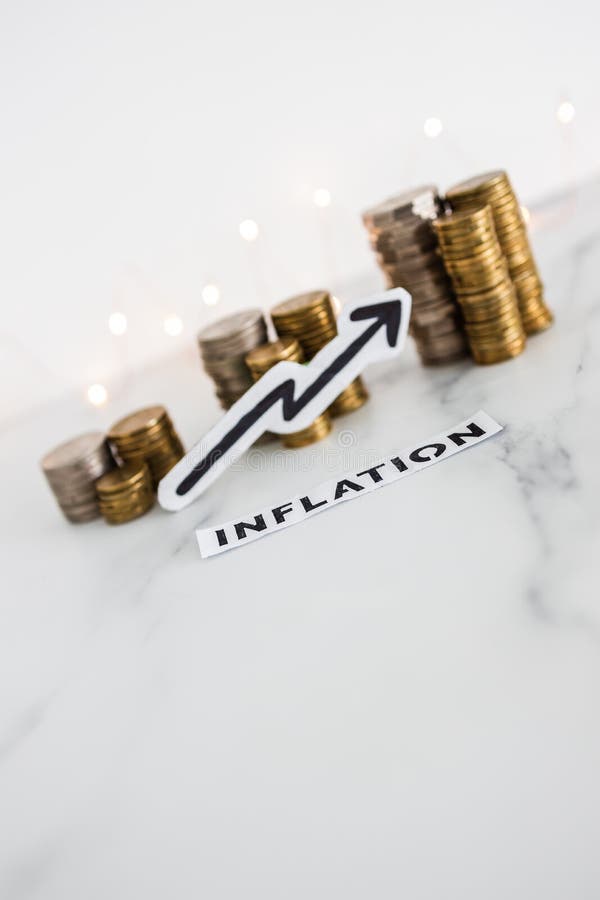 Inflation with Arrow Going Up in Front of Growing Stacks of Coins ...