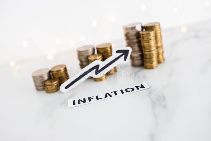 Inflation with Arrow Going Up in Front of Growing Stacks of Coins ...