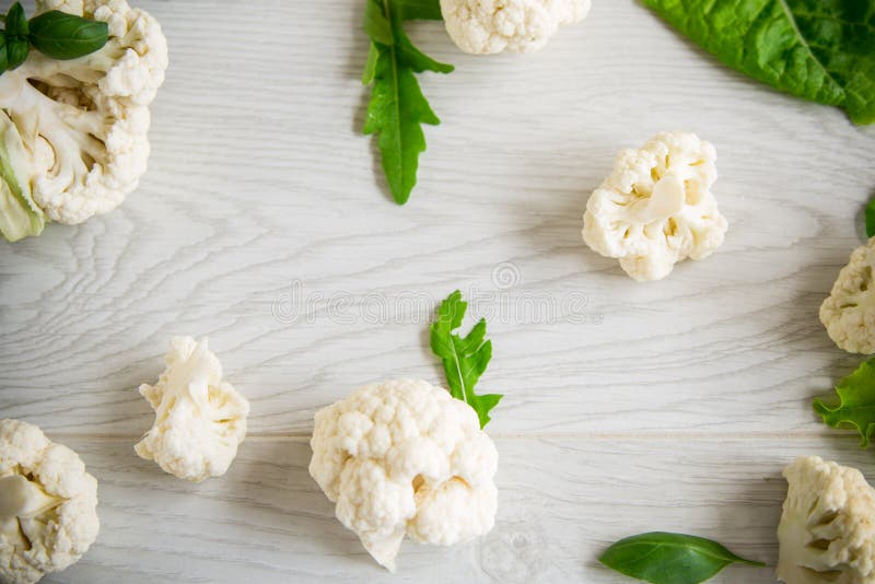 Inflorescences of Small Cauliflower on a Light Wooden Table Stock Photo ...